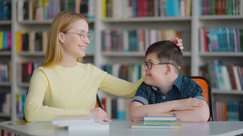 Teacher and Boy With Down Syndrome High-Five • Stock Video on Uppbeat
