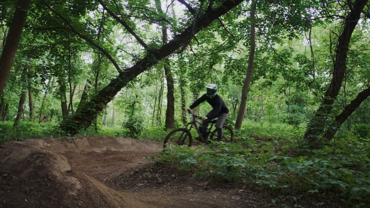 Cyclist Riding Mountain Bike on Dirt Track • Stock Video on Uppbeat