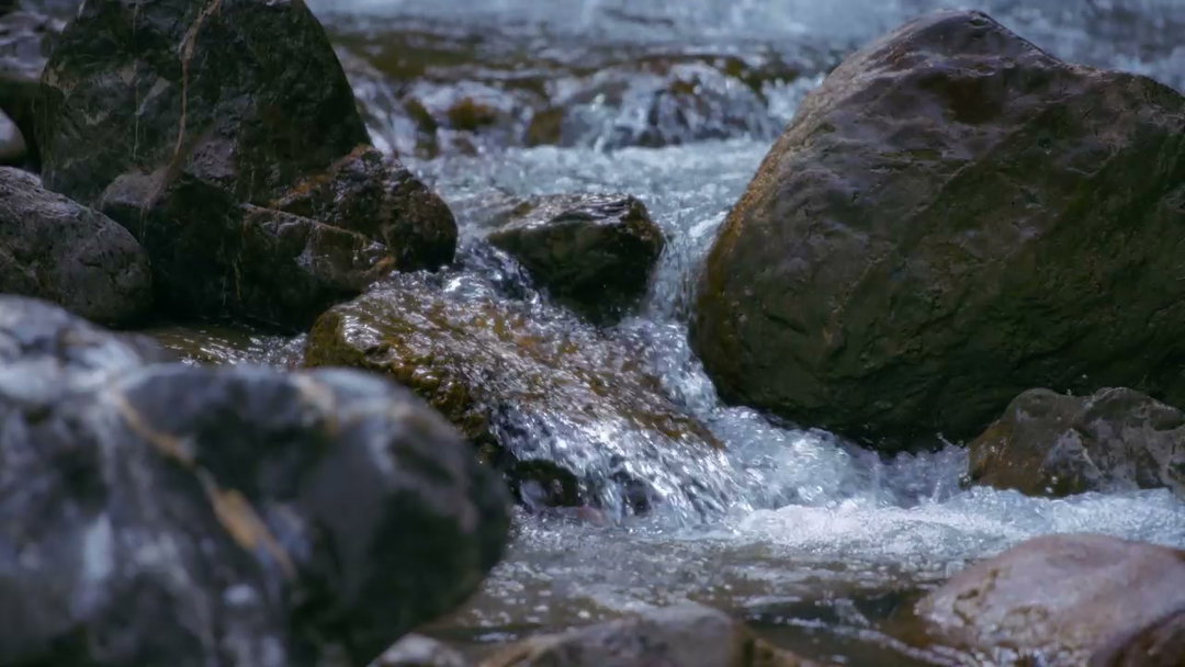 Water Flowing Over Rocks in Slow Motion • Stock Video on Uppbeat