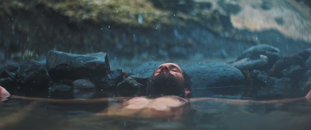 Man Relaxing in Icelandic Geothermal Hot Spring • Stock Video on Uppbeat