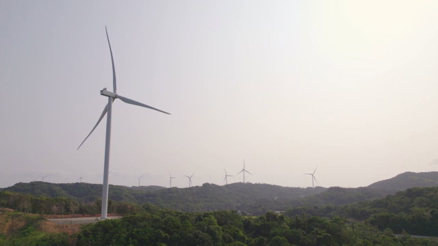 Sunrise Over Wind Turbines and Communication Tower • Stock Video on Uppbeat