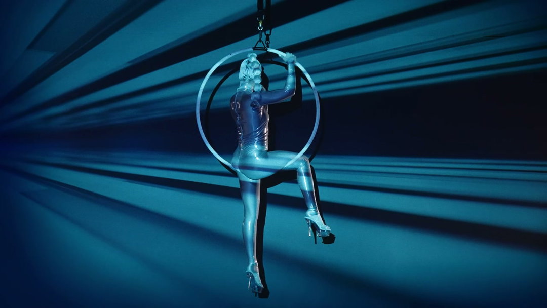 Aerial Acrobat Performing on Hoop in Blue Light • Stock Video on Uppbeat