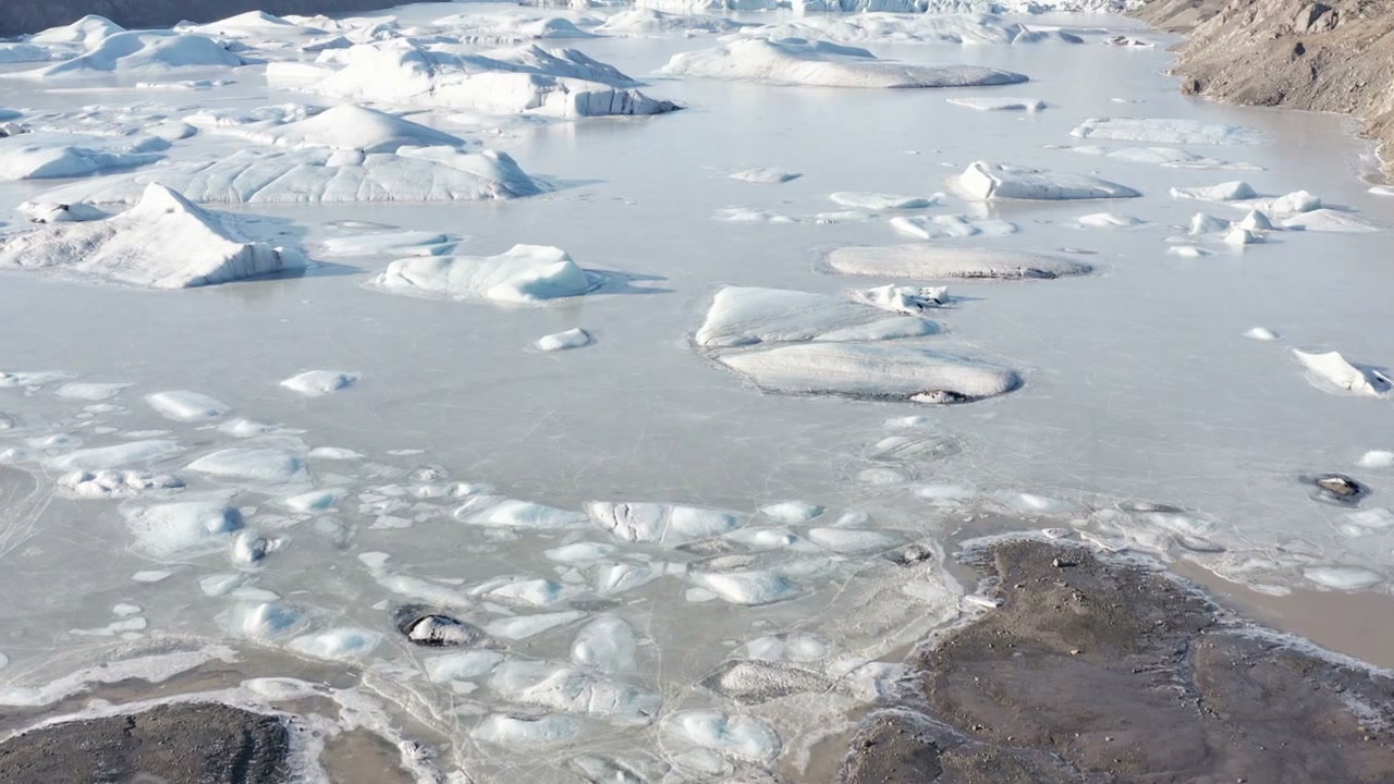 Aerial Pan to Blue Glacier and Icy Pond in Iceland • Stock Video on Uppbeat