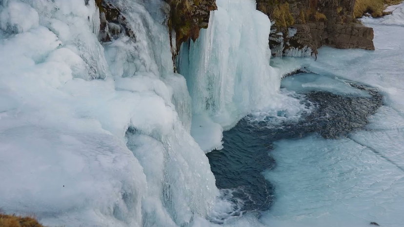 Frozen Waterfall with Flowing Water in Winter • Stock Video on Uppbeat