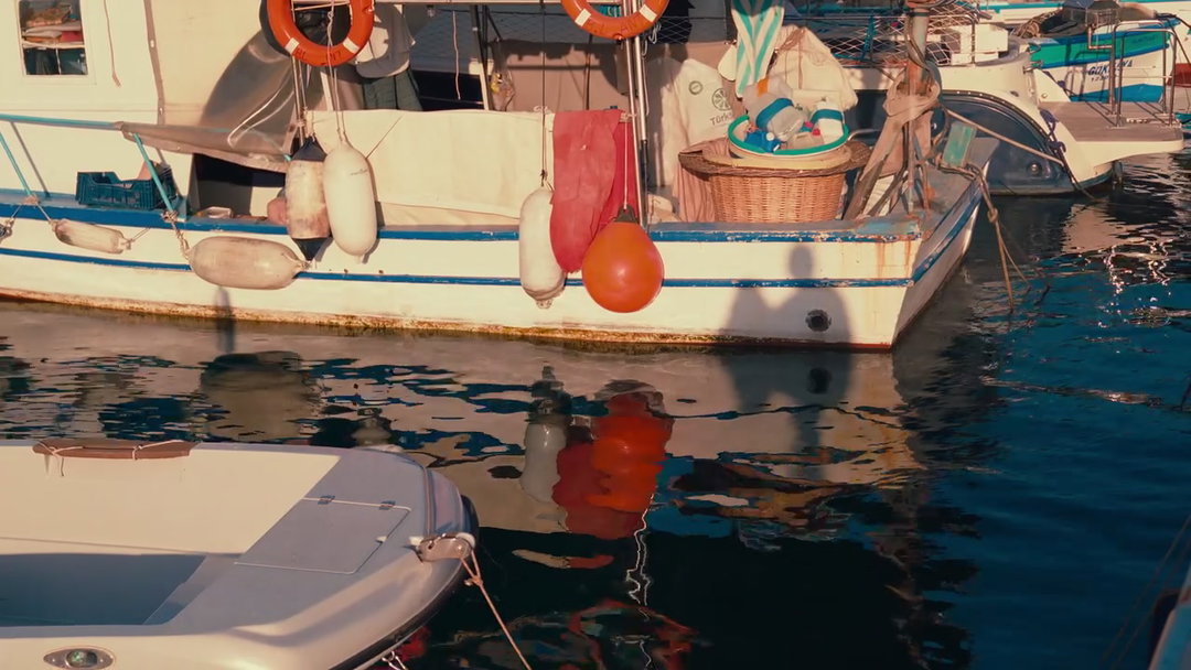 Water Ripples by a Wooden Dock with Boat • Stock Video on Uppbeat
