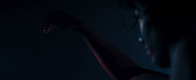 Dramatic Painted Figure in Blue and Red Light • Stock Video on Uppbeat