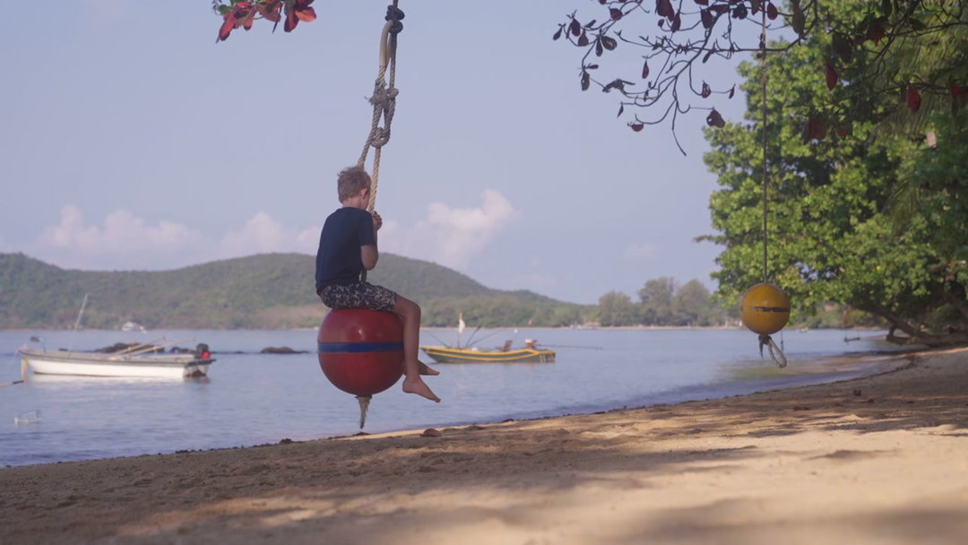 Boy Writing at a Campsite on 8mm Film • Stock Video on Uppbeat