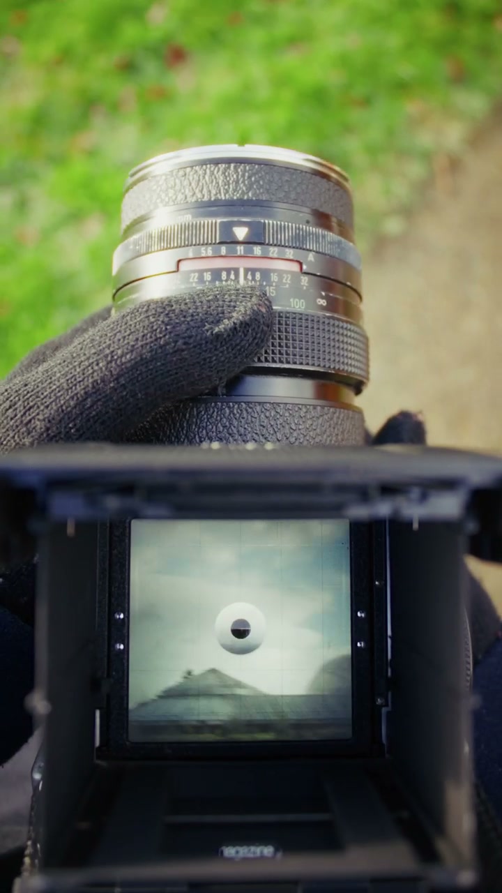 First-Person View Adjusting Retro Camera Focus • Stock Video on Uppbeat