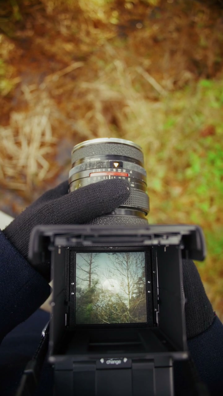 First-Person View Adjusting Retro Camera Focus • Stock Video on Uppbeat