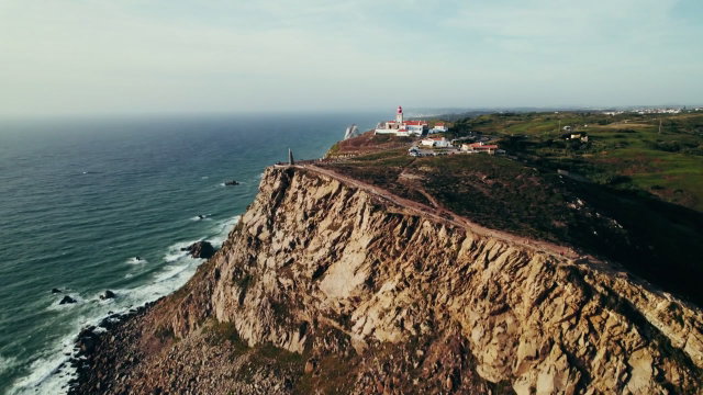 Lighthouse Flashing Light on Dark Coastal Cliffs • Stock Video on Uppbeat