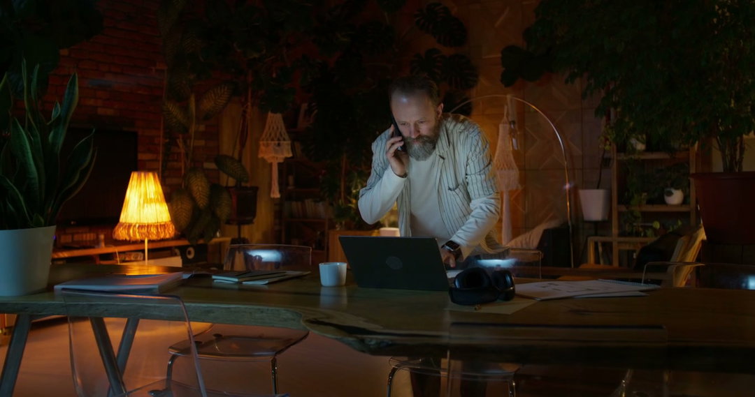 A woman uses a mobile phone at home • Stock Video on Uppbeat