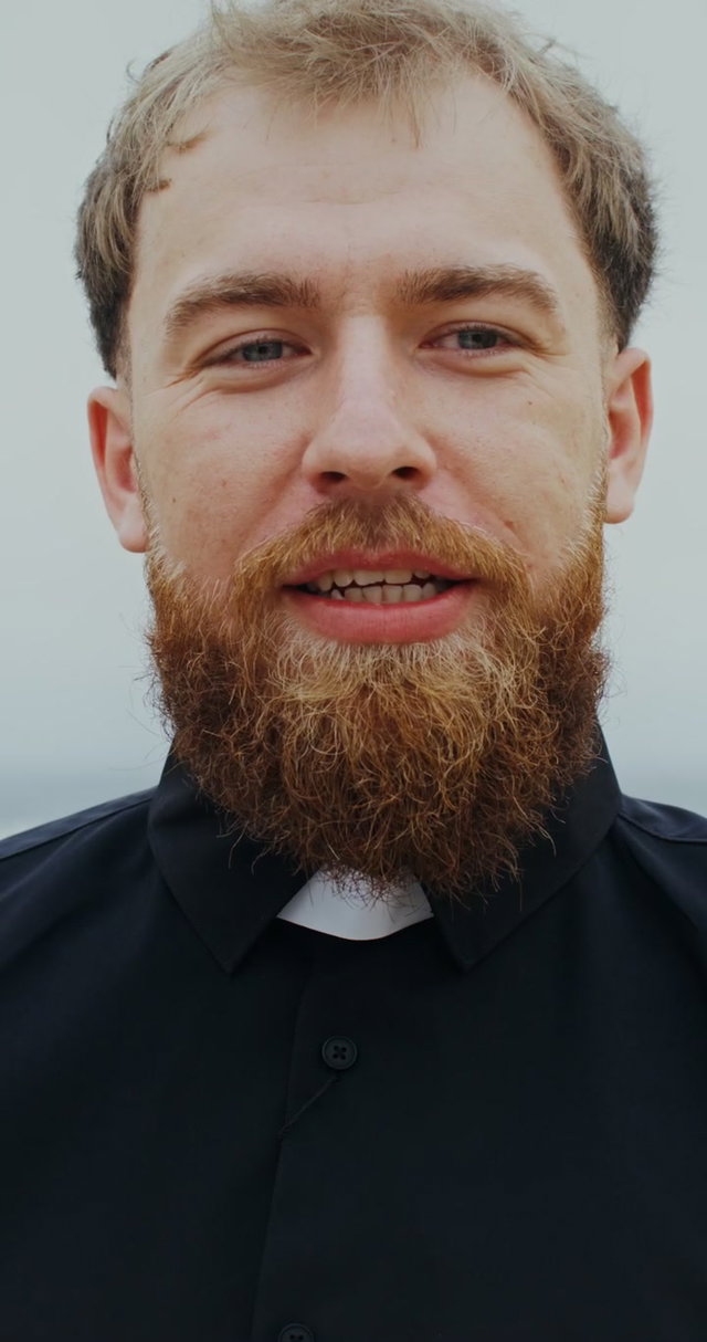 Man in Suit on Beach Looking at Ocean • Stock Video on Uppbeat