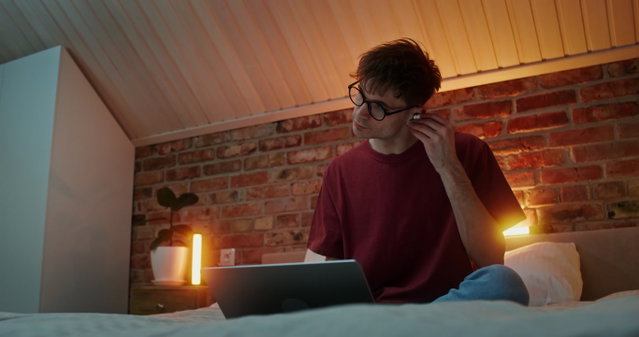 Man Falling Backwards Onto Bed • Stock Video on Uppbeat