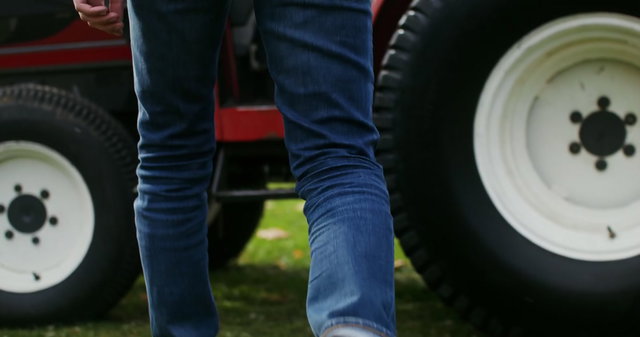 Farmer Eating Lunch by Tractor in Field • Stock Video on Uppbeat