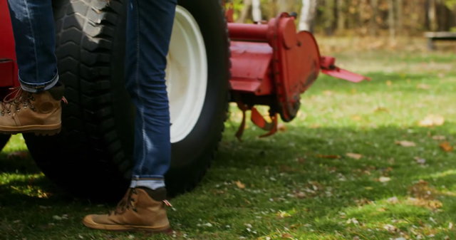 Farmer Driving Tractor Through a Green Field • Stock Video on Uppbeat