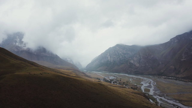 Winding River Through Lush Mountain Forest • Stock Video on Uppbeat