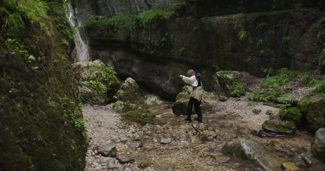 Person Stepping Through Rocky Stream in Gorge • Stock Video on Uppbeat