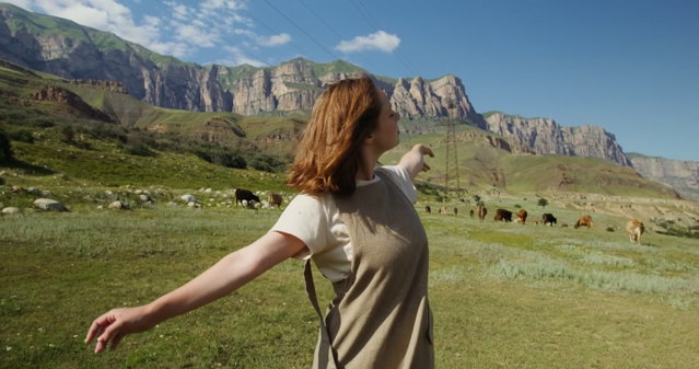 Dancing Woman on Mountain Viewpoint • Stock Video on Uppbeat