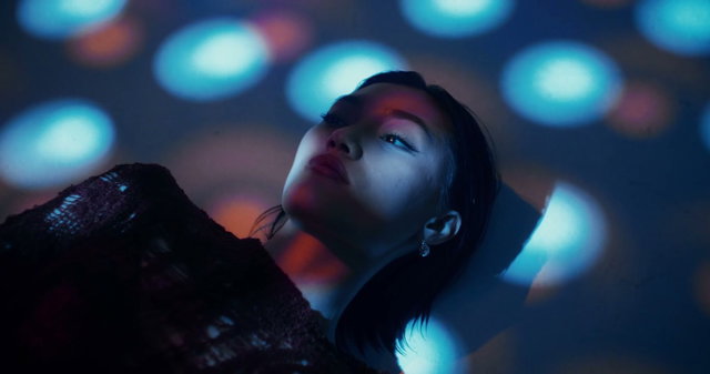 Dramatic Painted Figure in Blue and Red Light • Stock Video on Uppbeat